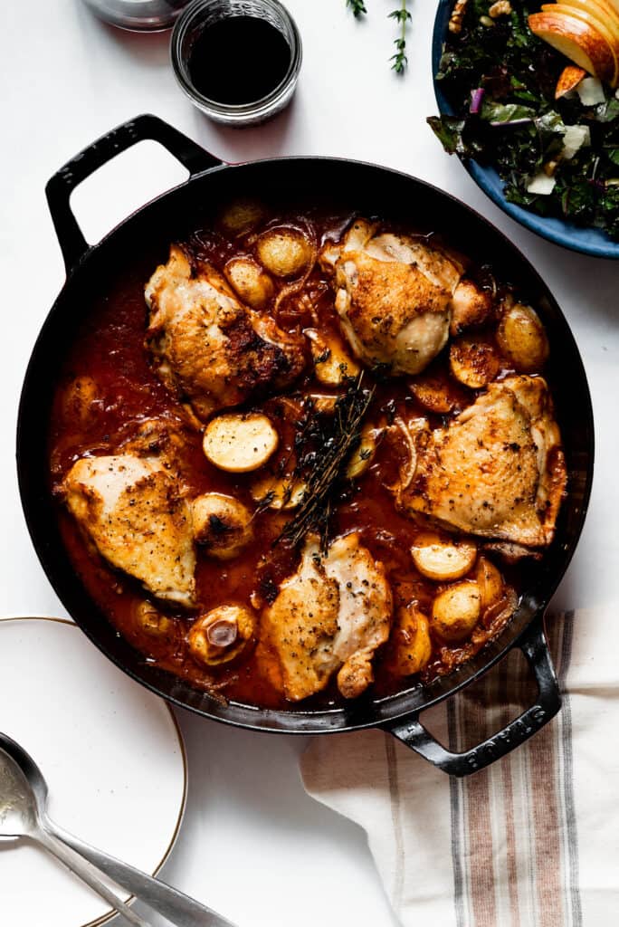 Dutch Oven Apple Cider Braised Chicken Thighs and Potatoes - Shutter + Mint